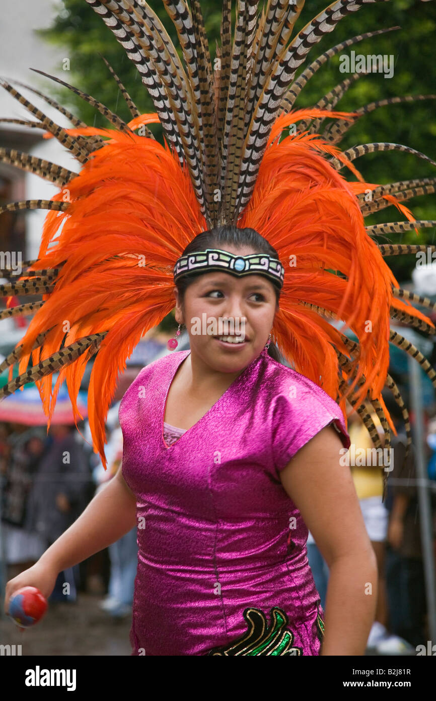 A MEXICAN woman dances in AZTEC COSTUME in the FESTIVAL DE SAN MIGUEL ...