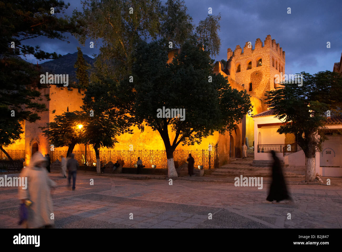 Plaza Uta el-Hammam and the Fondouk at dusk, Chefchaouen, Morocco Stock ...