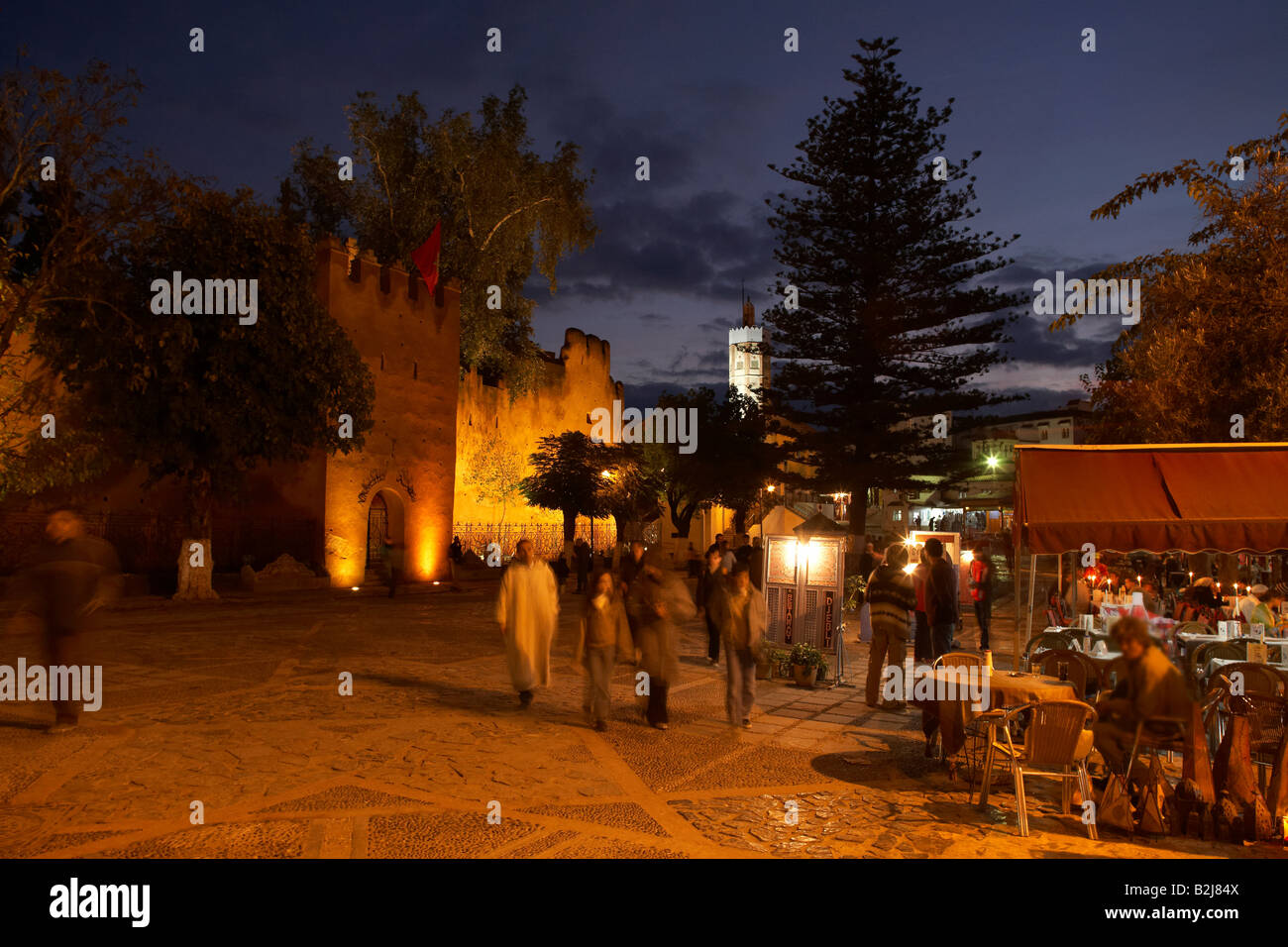 Plaza Uta el-Hammam and the Fondouk at dusk, Chefchaouen, Morocco Stock ...