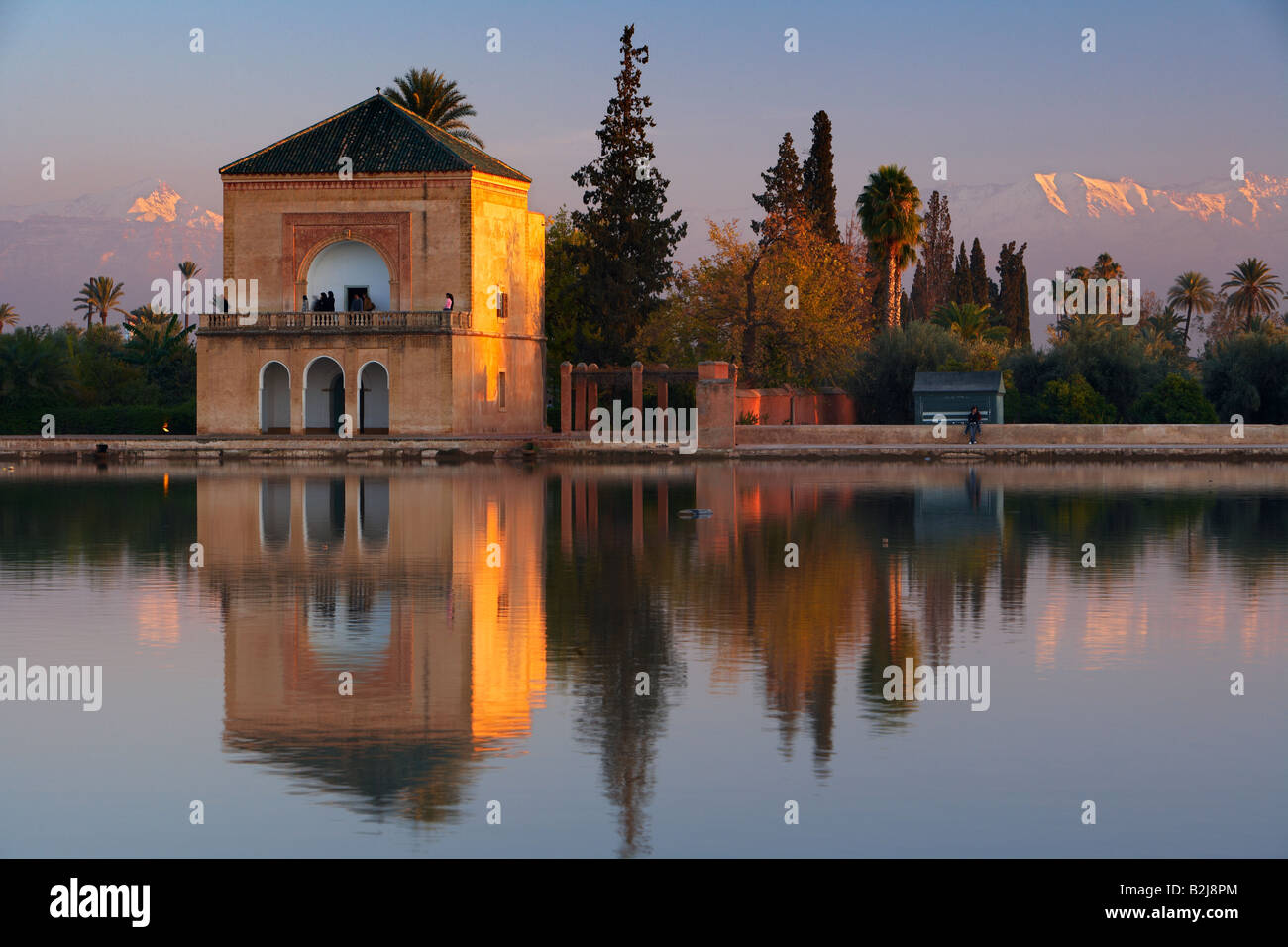 the pool and pavillion in the Menara Imperial Garden with the Atlas ...