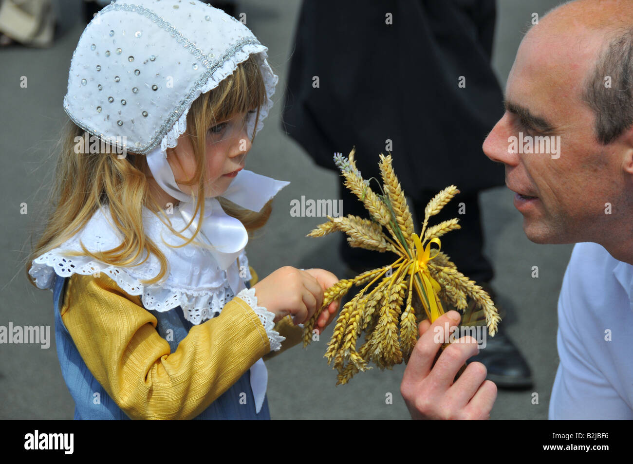 french kid with her father dressed in traditional costume with headgear ...