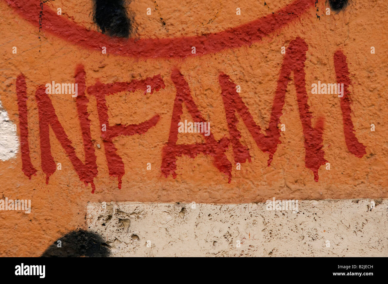 Graffiti of the word Infami shot in Sicily Italy Stock Photo - Alamy