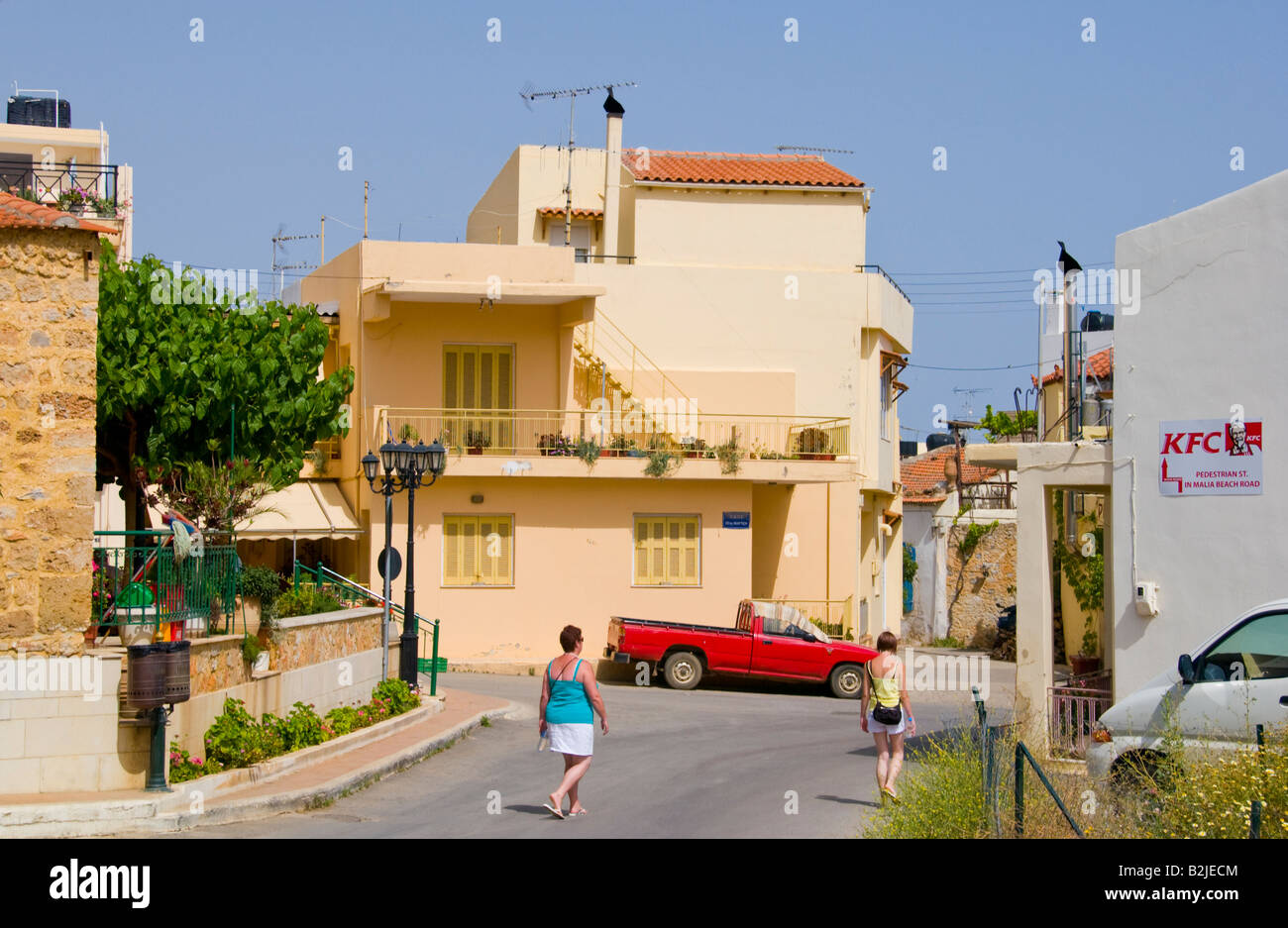 Street scene with tourists in Malia Old Town on the Greek Mediterranean ...