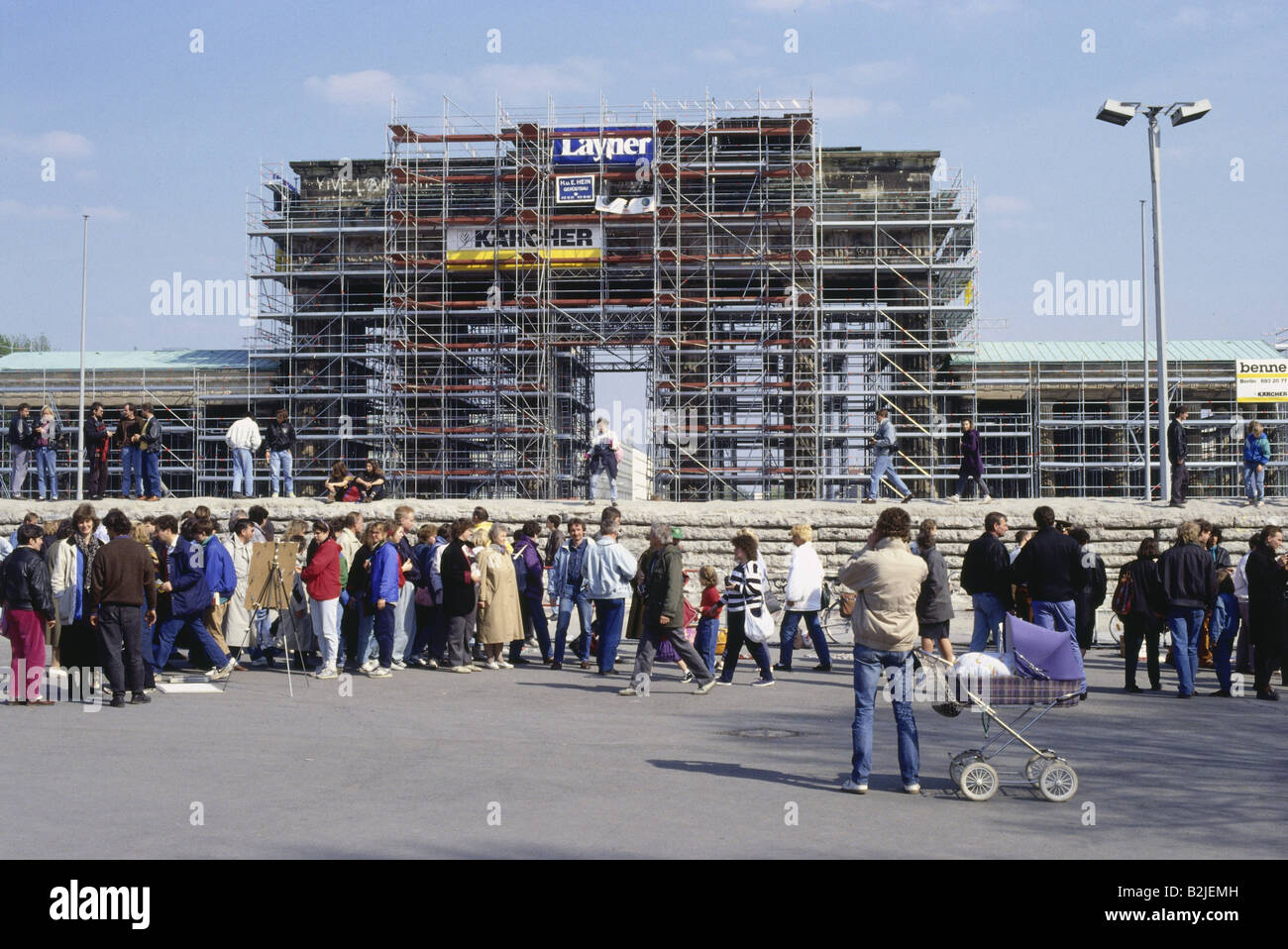 Germany, reunification, fall of the Berlin Wall, people at and standing ...