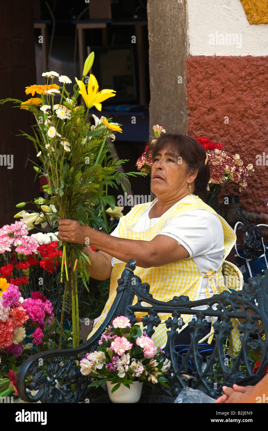 A MEXICAN WOMAN making FLOWER ARRANGEMENTS in historic GUANAJUATO ...