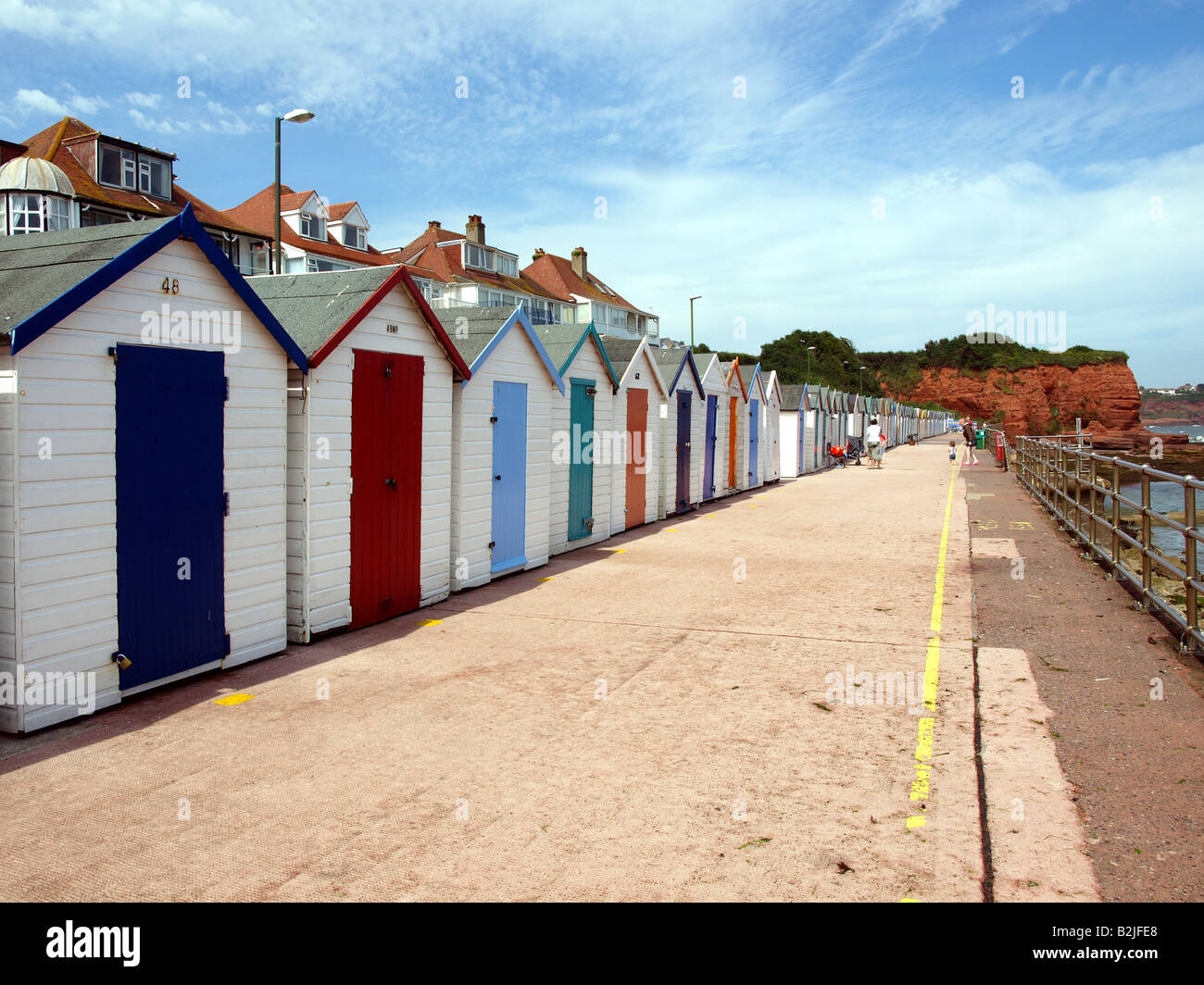 Beach huts and hotels along the promenade at Paignton,The English ...