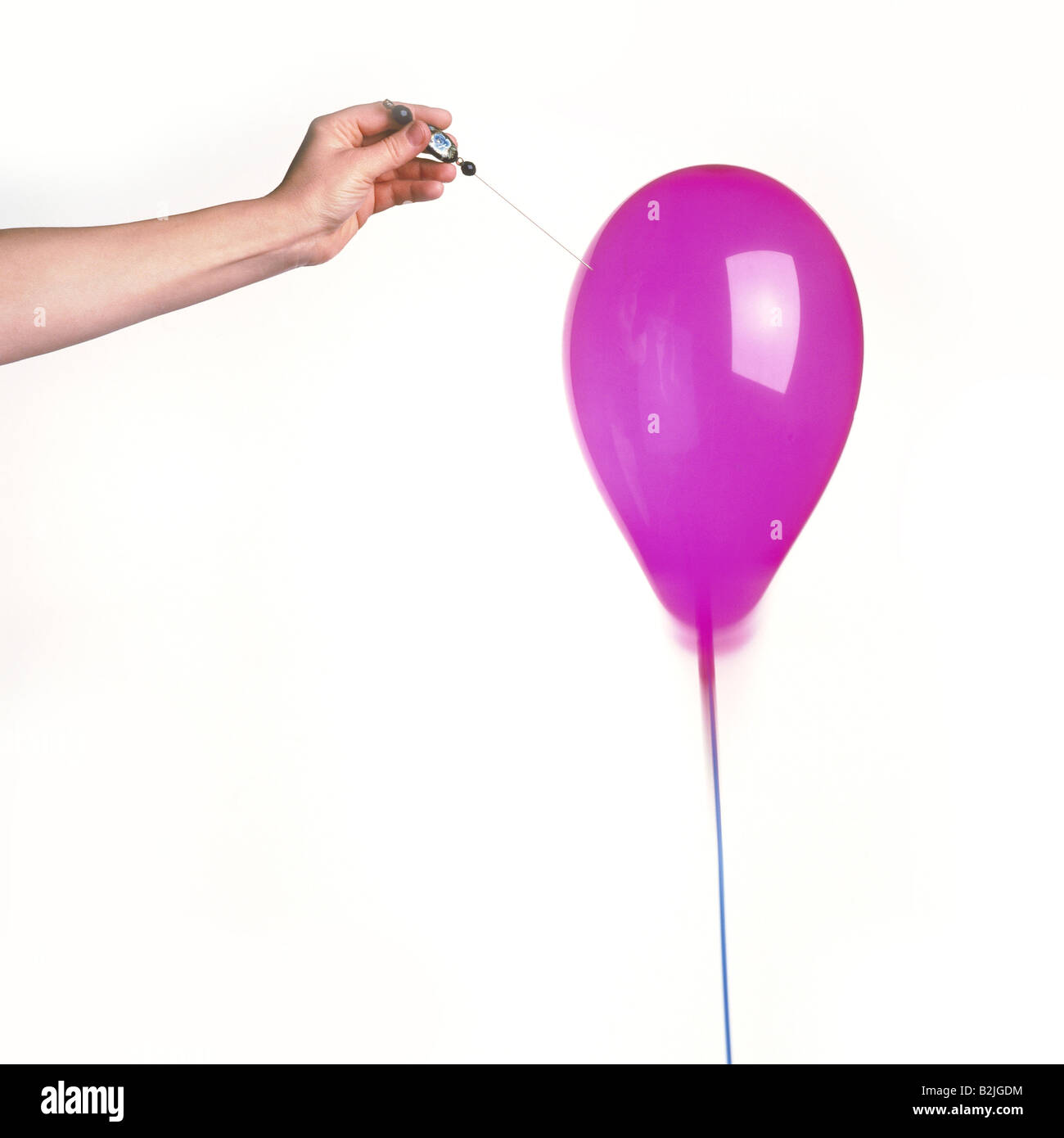 purple balloon with hand cut out on white background Stock Photo - Alamy