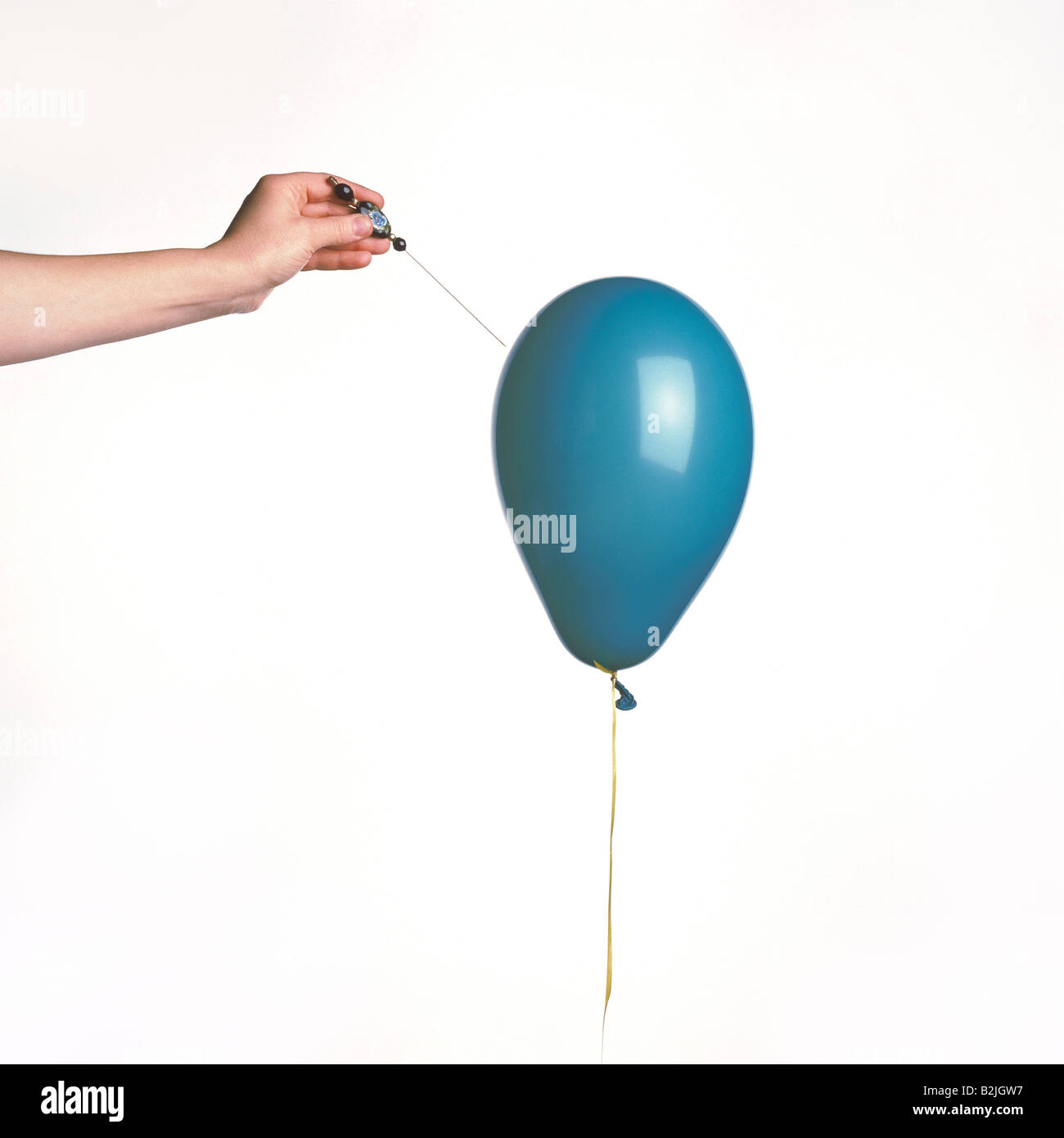 blue balloon with hand cut out on white background Stock Photo - Alamy