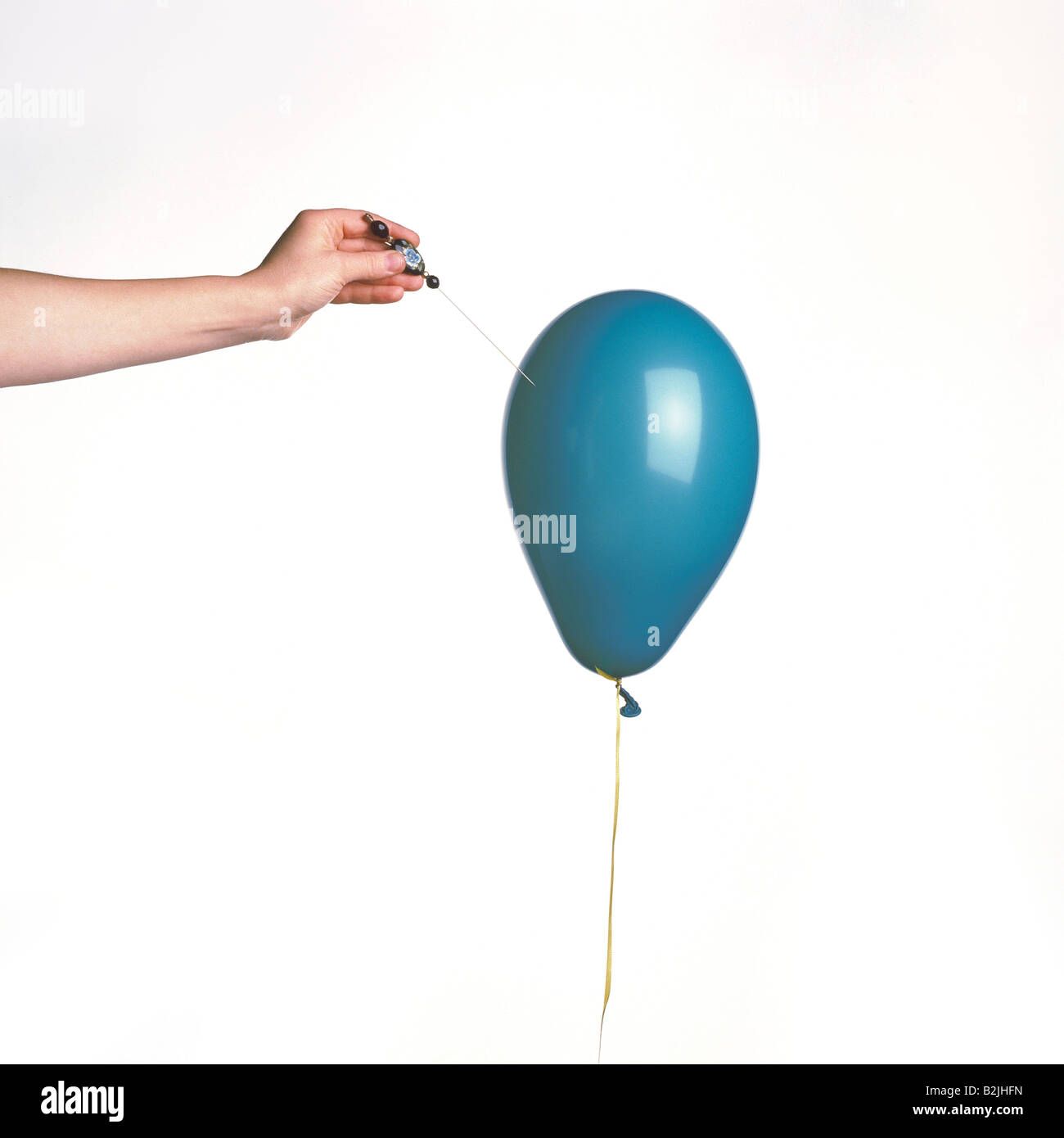 blue balloon with hand cut out on white background Stock Photo - Alamy