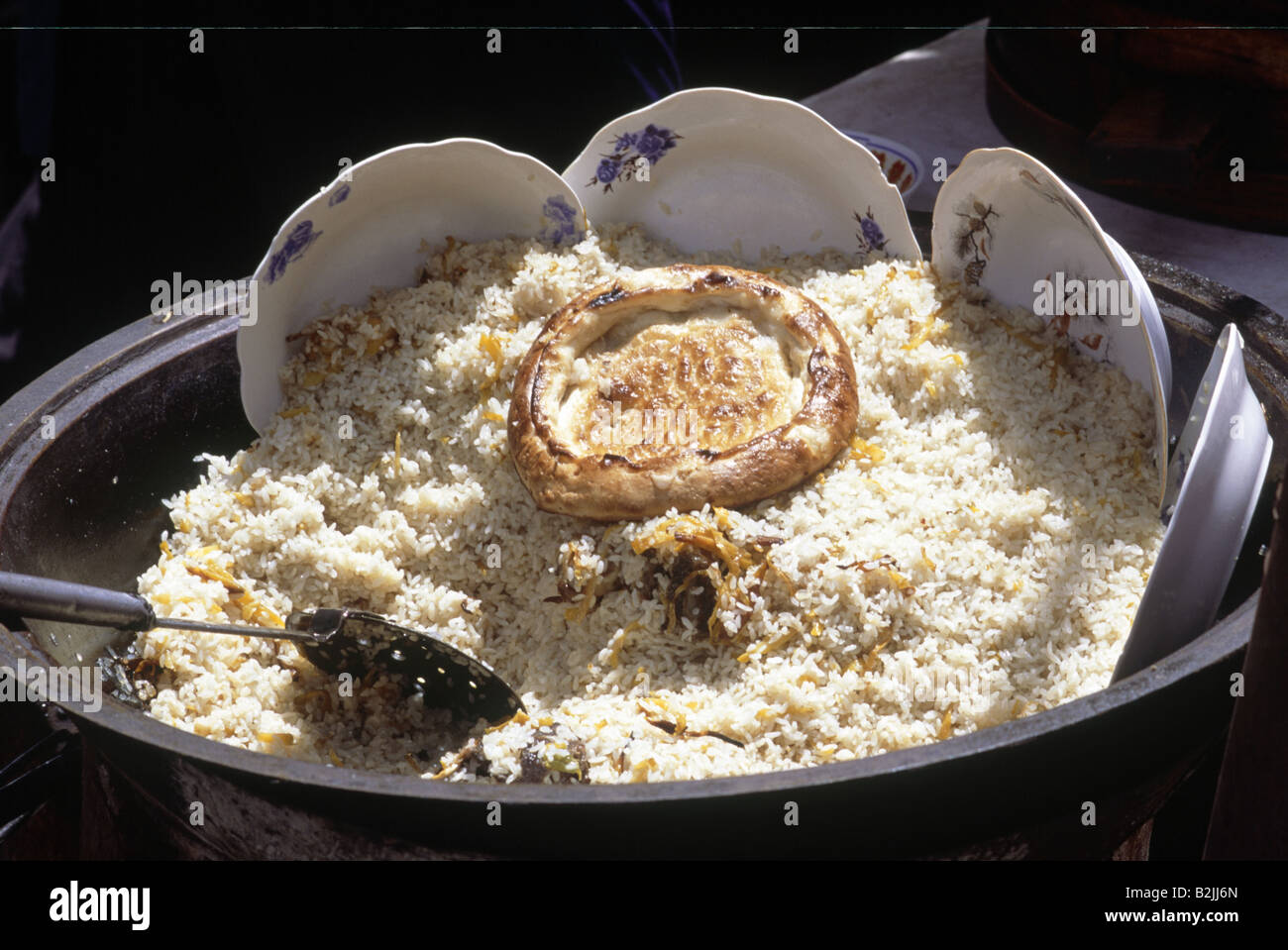 Town Sunday market Uygur food stall Big bowl of rice Flatbread Plates ...