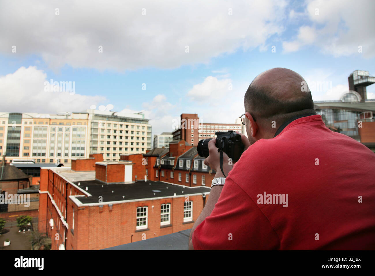 red photographer in London Stock Photo - Alamy
