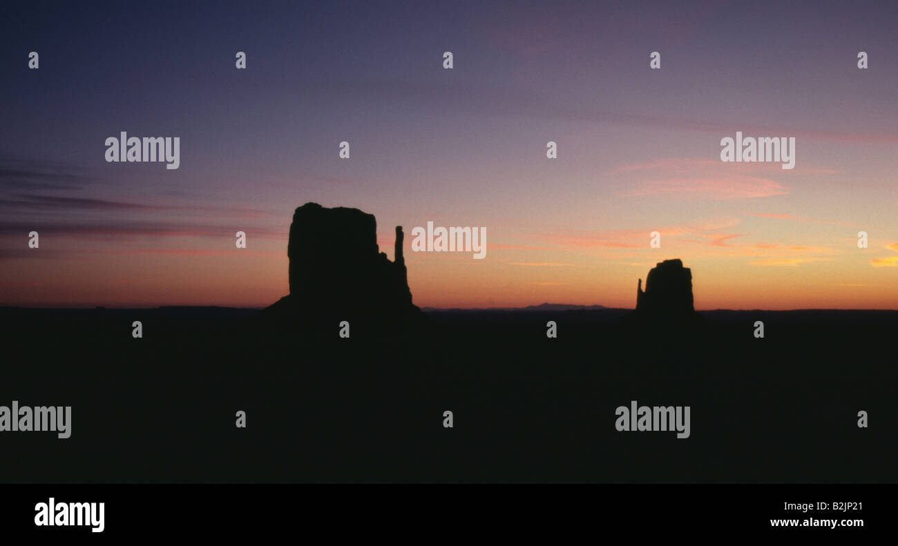 A Tall Butte Left Mitten in Monument Valley Utah provides the backdrop ...