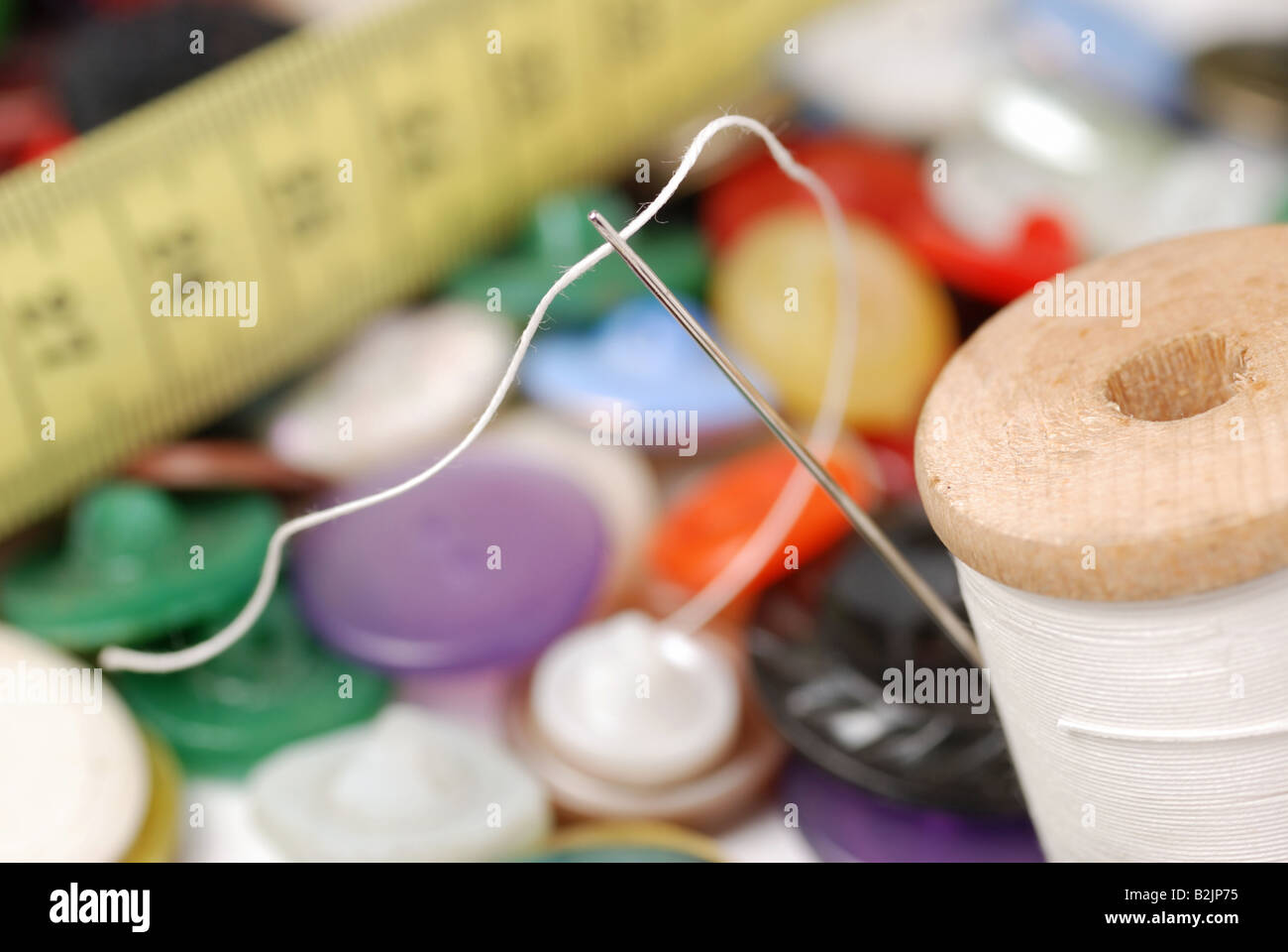 Needle and a thread A set of accessories for sewing Stock Photo - Alamy