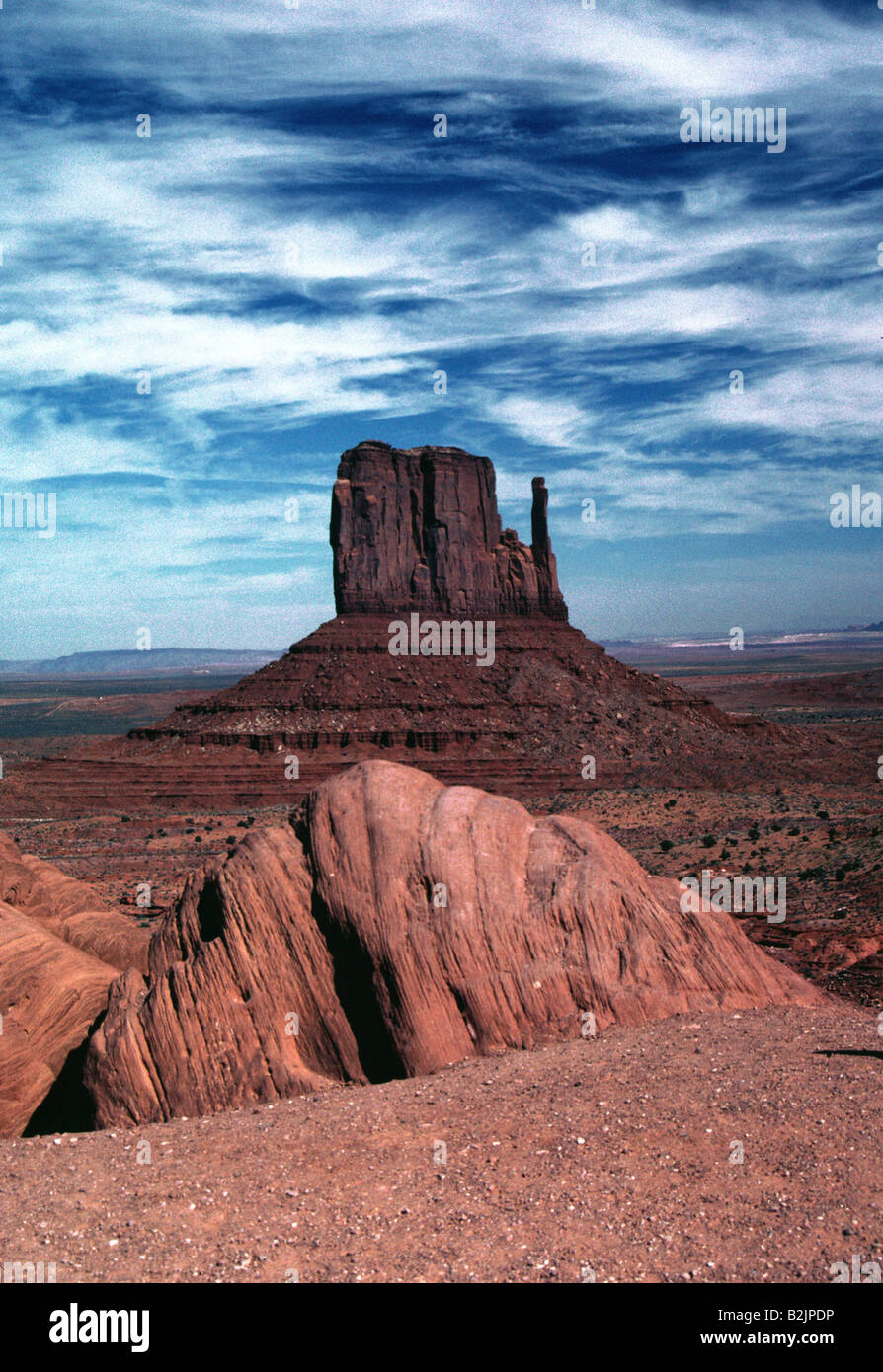 A Tall Butte Left Mitten in Monument Valley Utah provides the backdrop ...