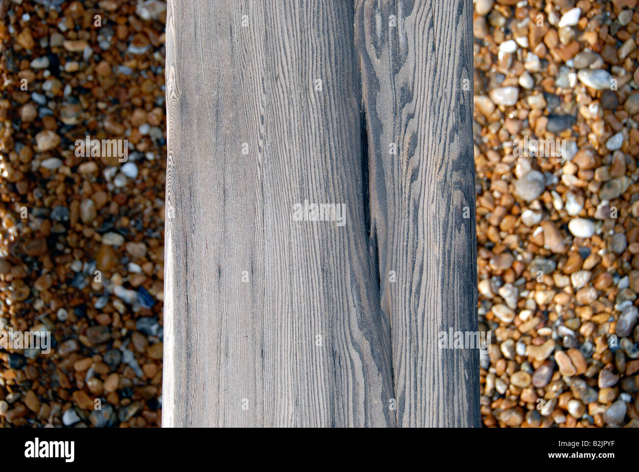 Detail of wooden groyne sea defence on the beach at Camber Sands, East ...