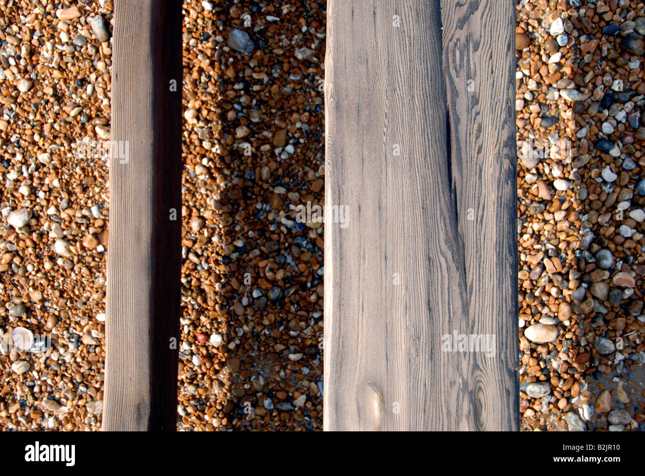 Detail of wooden groyne sea defence on the beach at Camber Sands, East ...