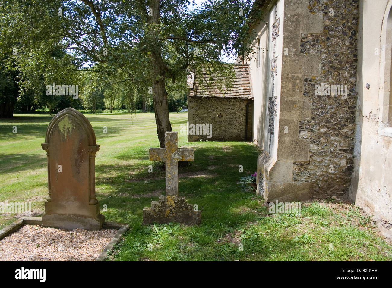 Two gravestones at side of Avington church- Saxon Stock Photo - Alamy