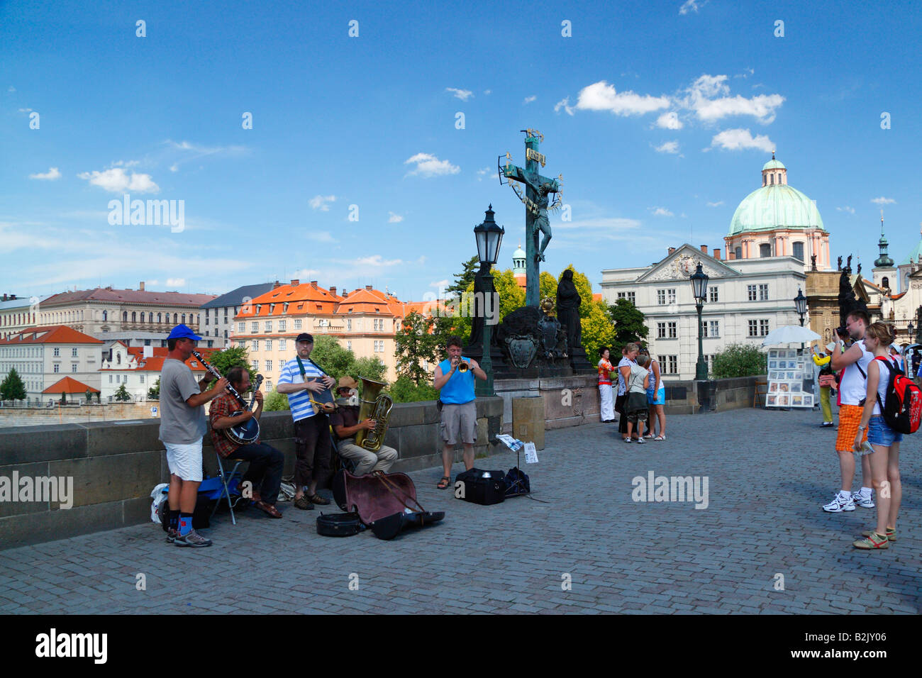 A traditional Czech folk band performing at Charles Bridge in Prague ...