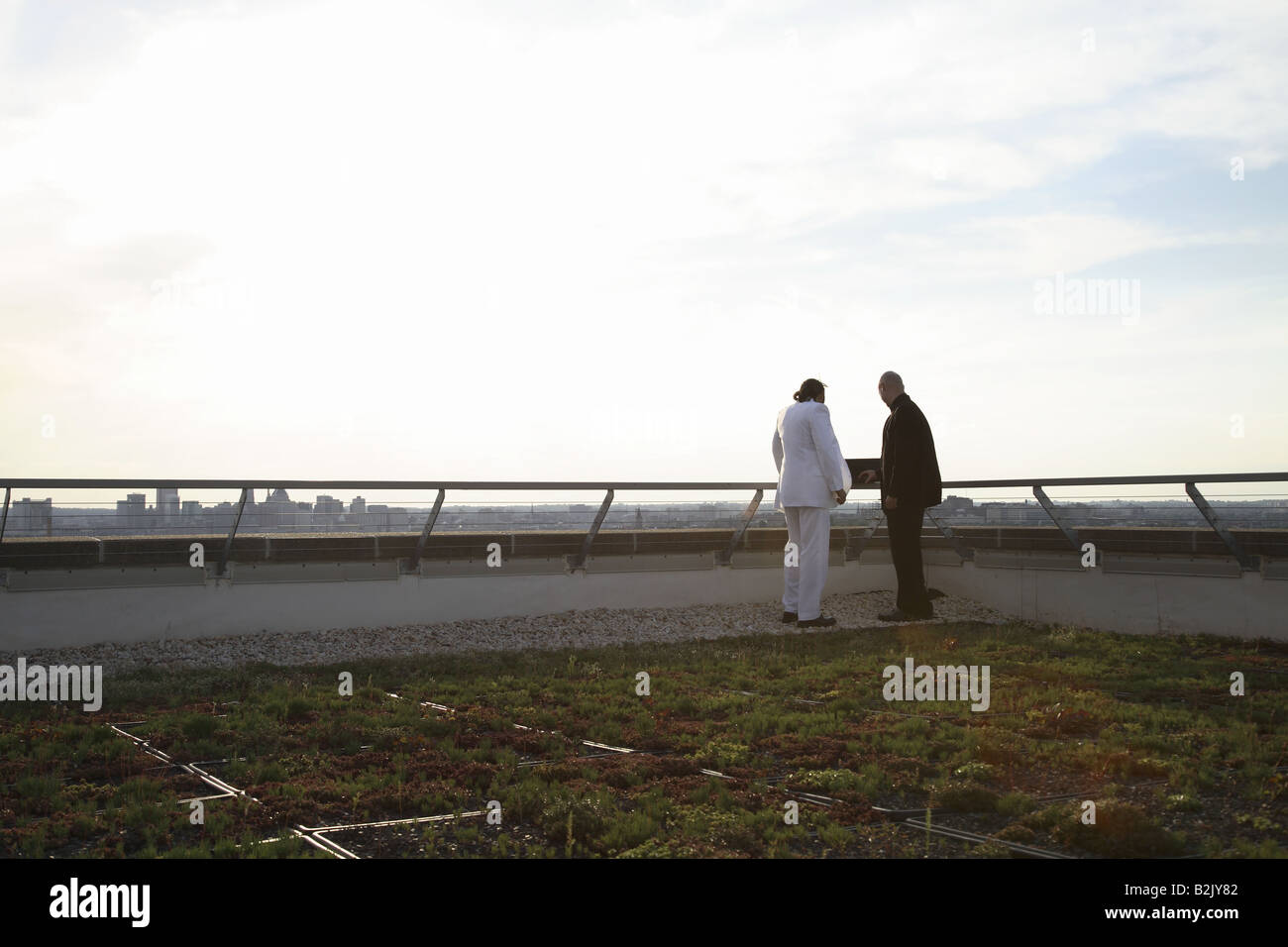 two men on rooftop Stock Photo - Alamy