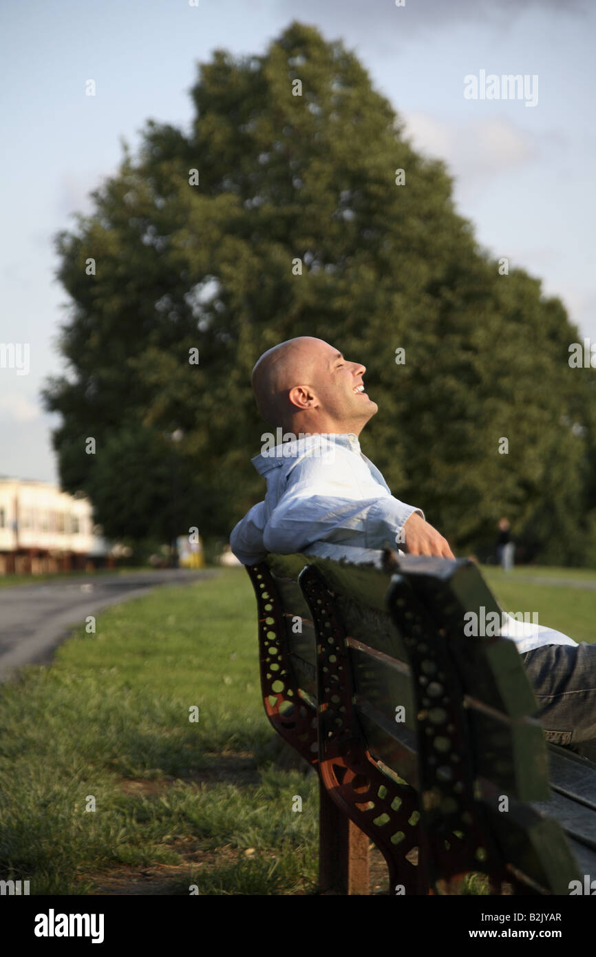 man on park bench Stock Photo - Alamy