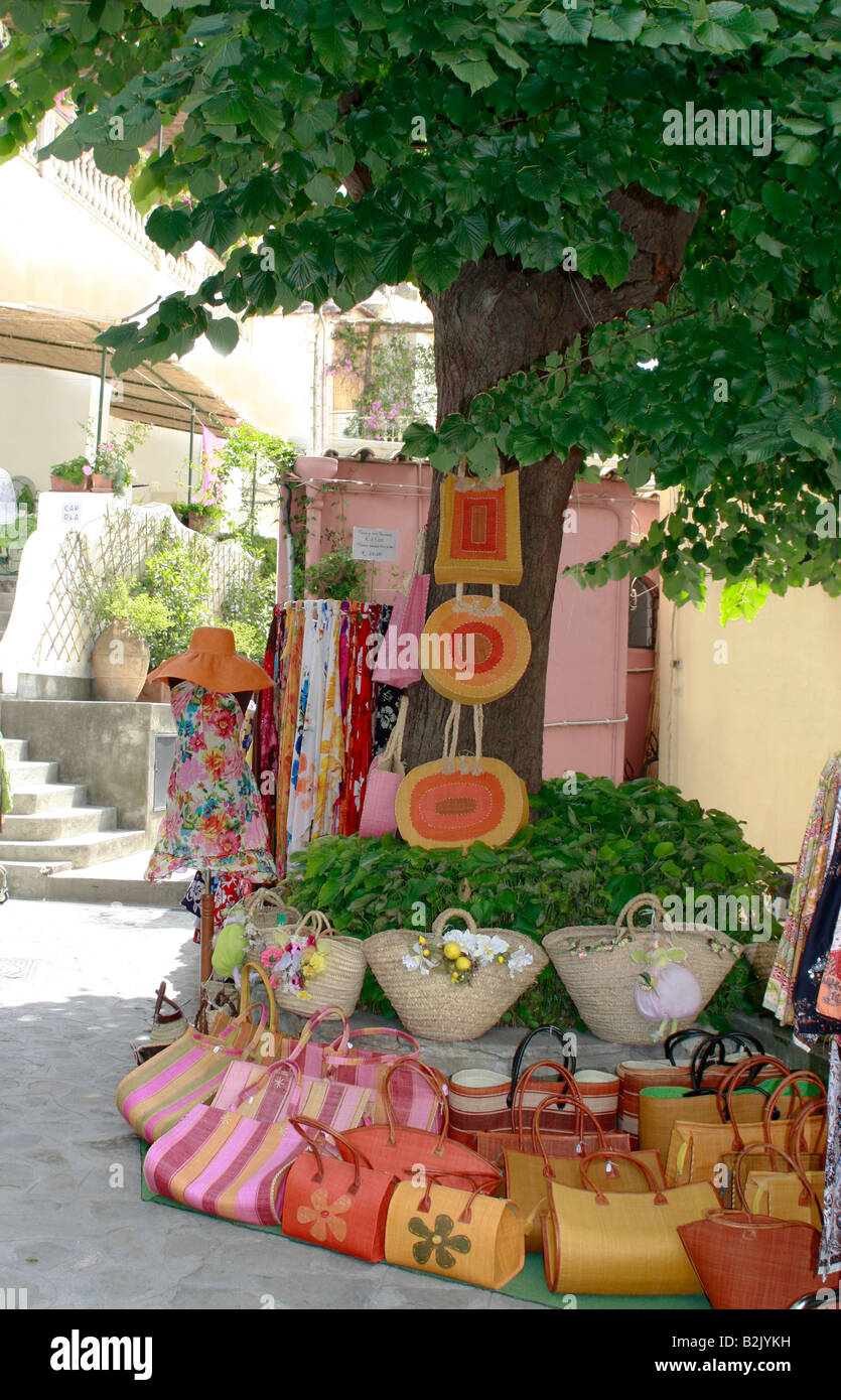 pretty shop display arounda growing tree in a coutyard for souvenir ...