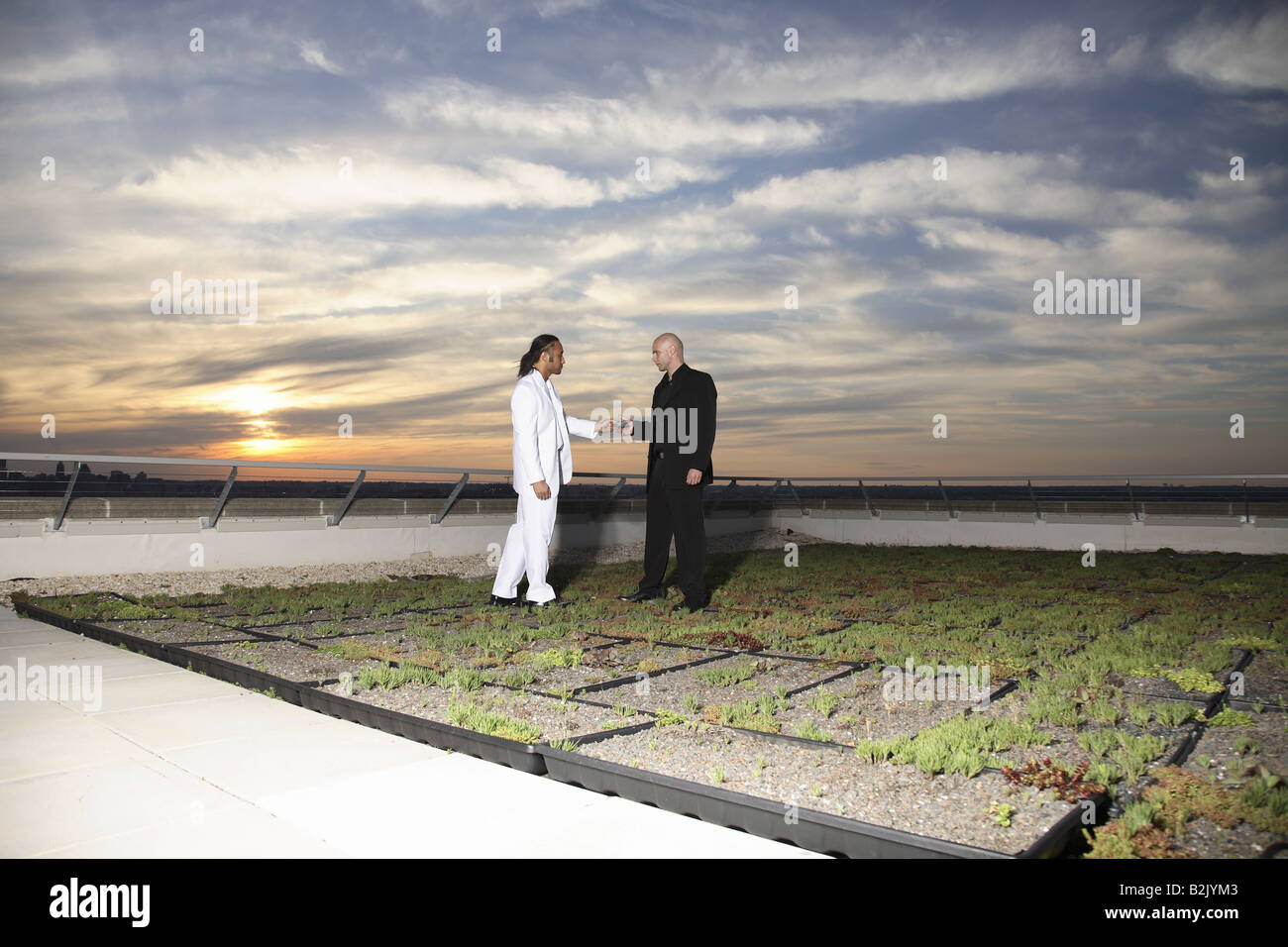 two men on rooftop Stock Photo - Alamy