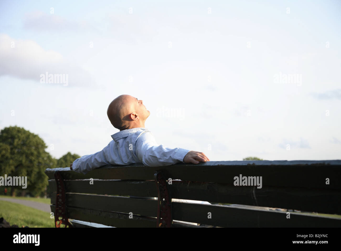 man on park bench Stock Photo - Alamy