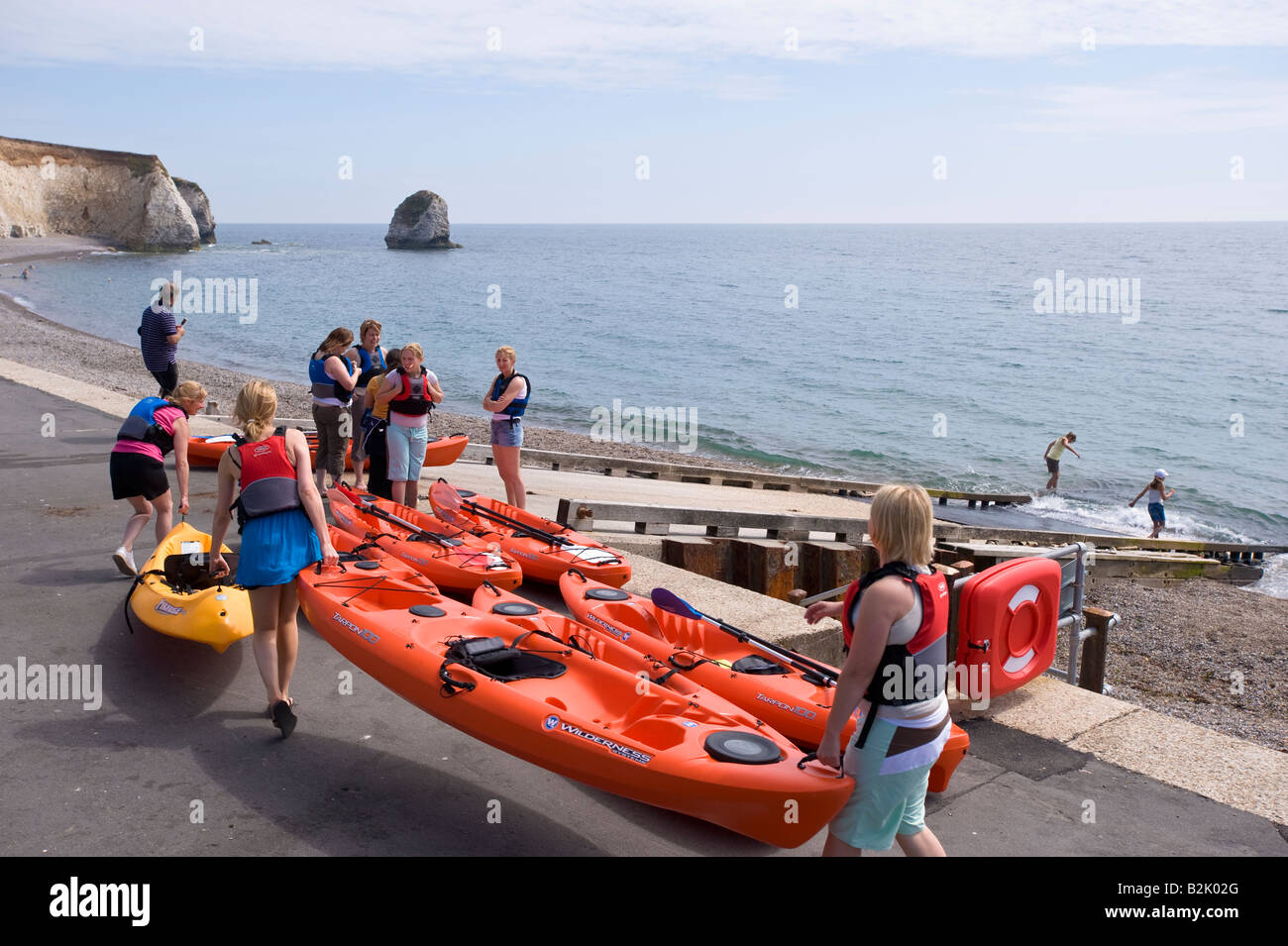 Group of teenage girls setting out on a kayaking trip around Freshwater ...