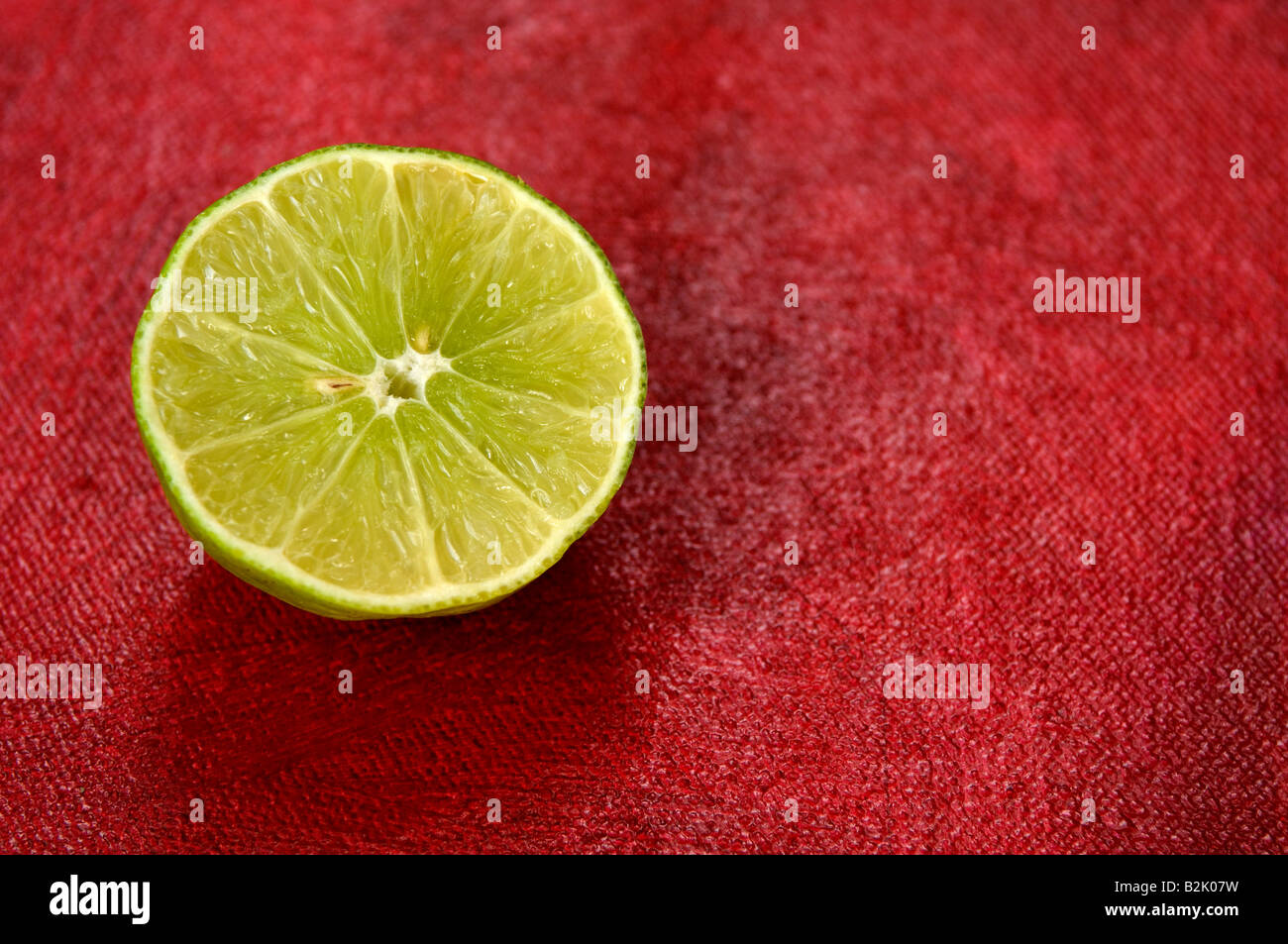 Lime cut in half Stock Photo - Alamy