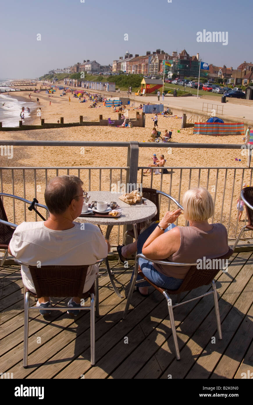 People On Southwold Pier Look Out Over Beach On A Hot Summers Day Stock ...