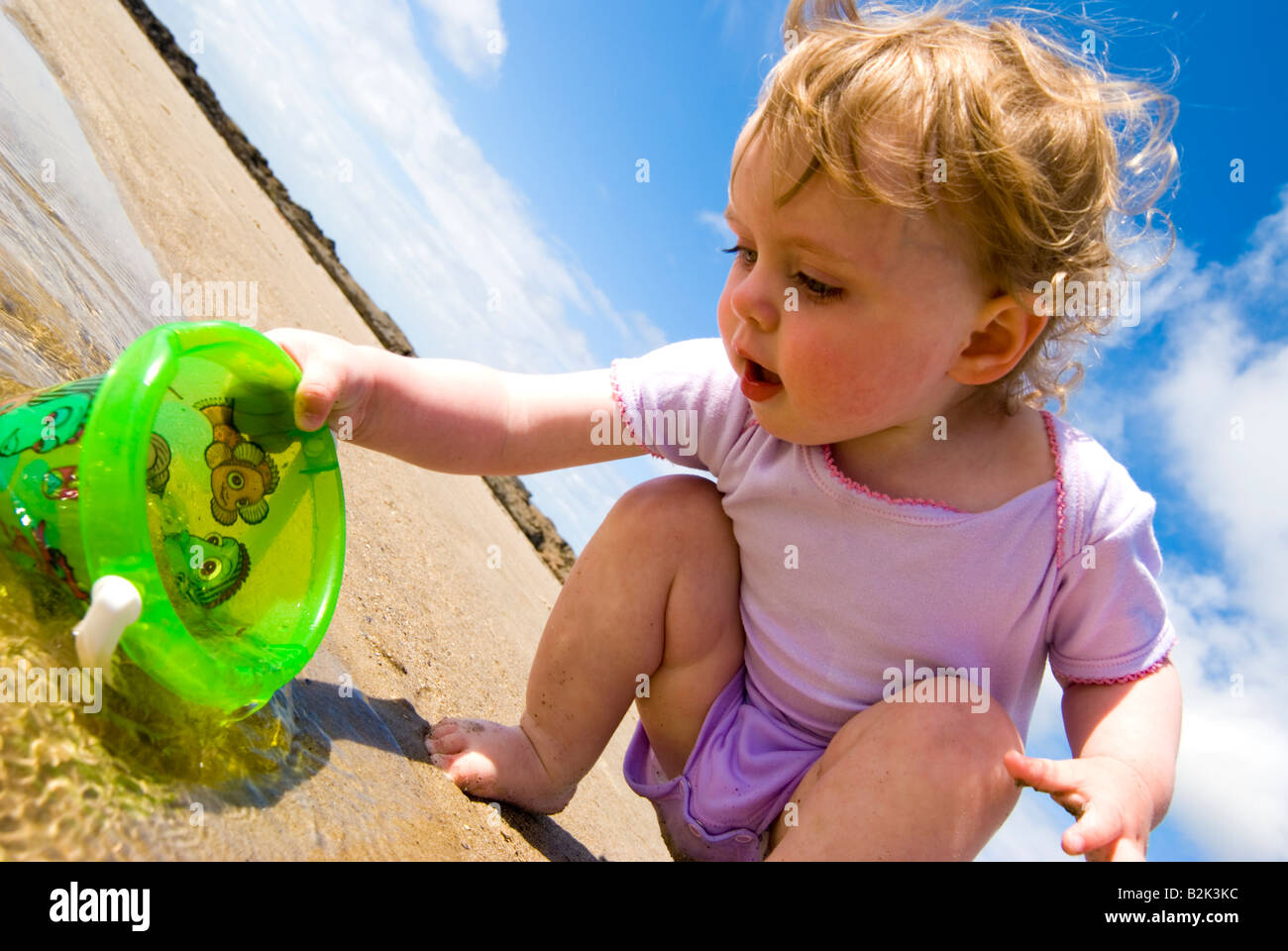 Ardara County Donegal Ireland Child plays on beach with water and ...