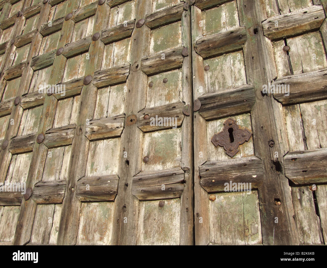 detail of big old green wooden door keyhole Stock Photo - Alamy