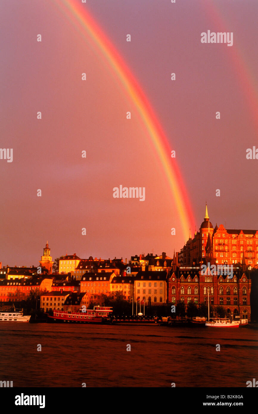 Rainbow over Sodermalm with boats, church and apartment buildings in ...
