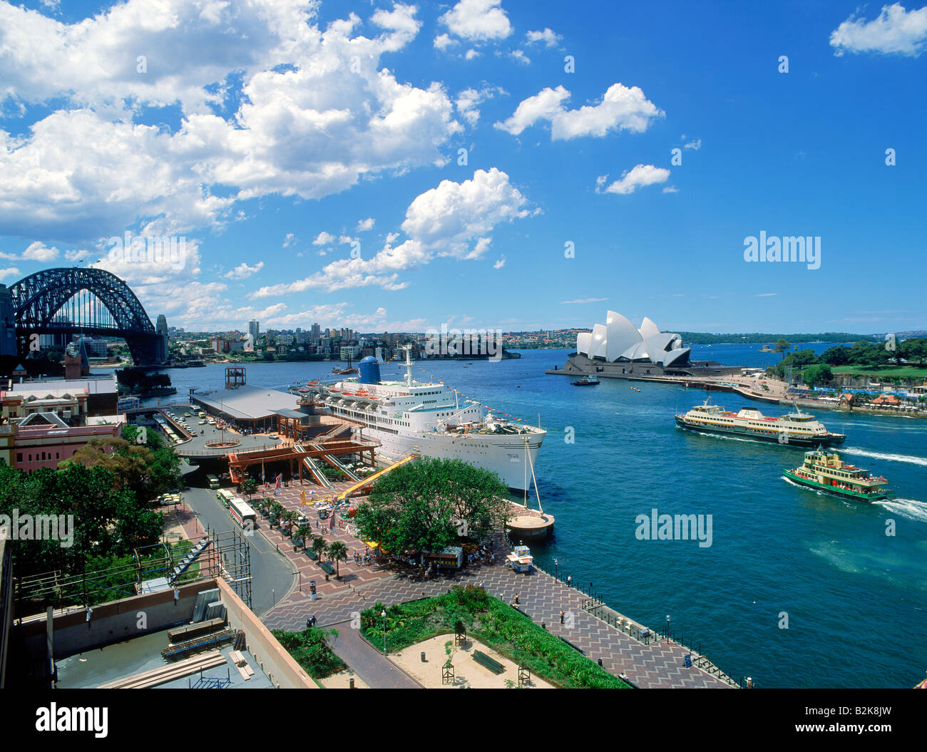 Passenger ship and ferryboats at the Sydney Harbor Quay with Opera ...