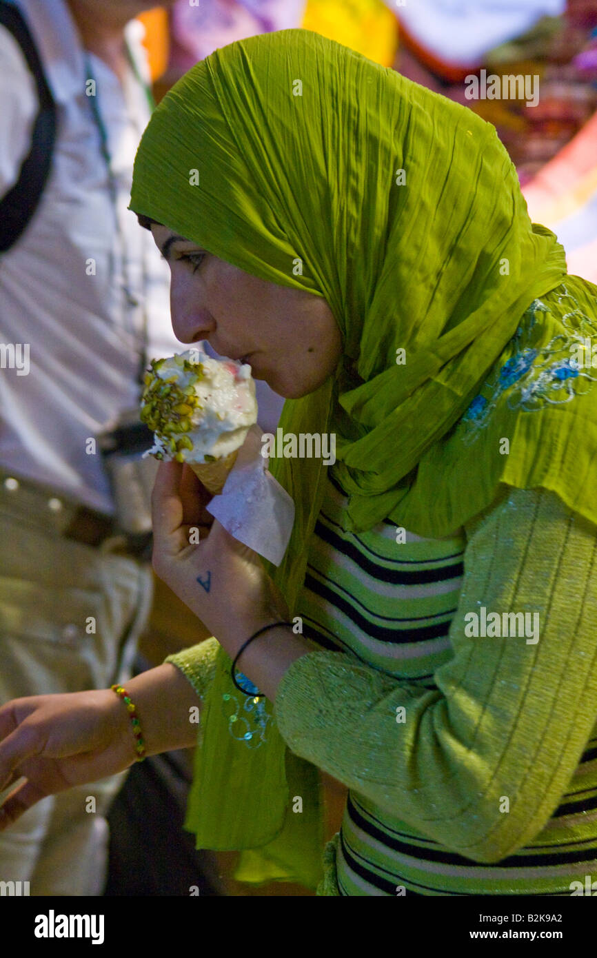 Muslim woman eating ice cream hi-res stock photography and images - Alamy