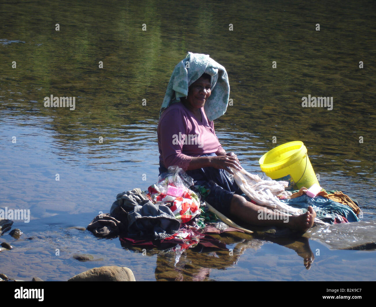 Lady washing clothes hi-res stock photography and images - Alamy