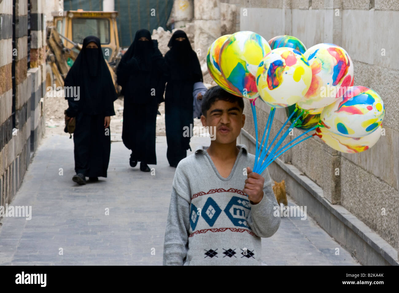 Muslim Women Wearing Burka and Boy Selling balloons Outside Umayyad ...