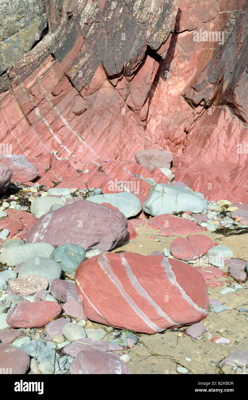 Red rocks beqach stones and pebbles St David's head Pembrokeshire wales ...
