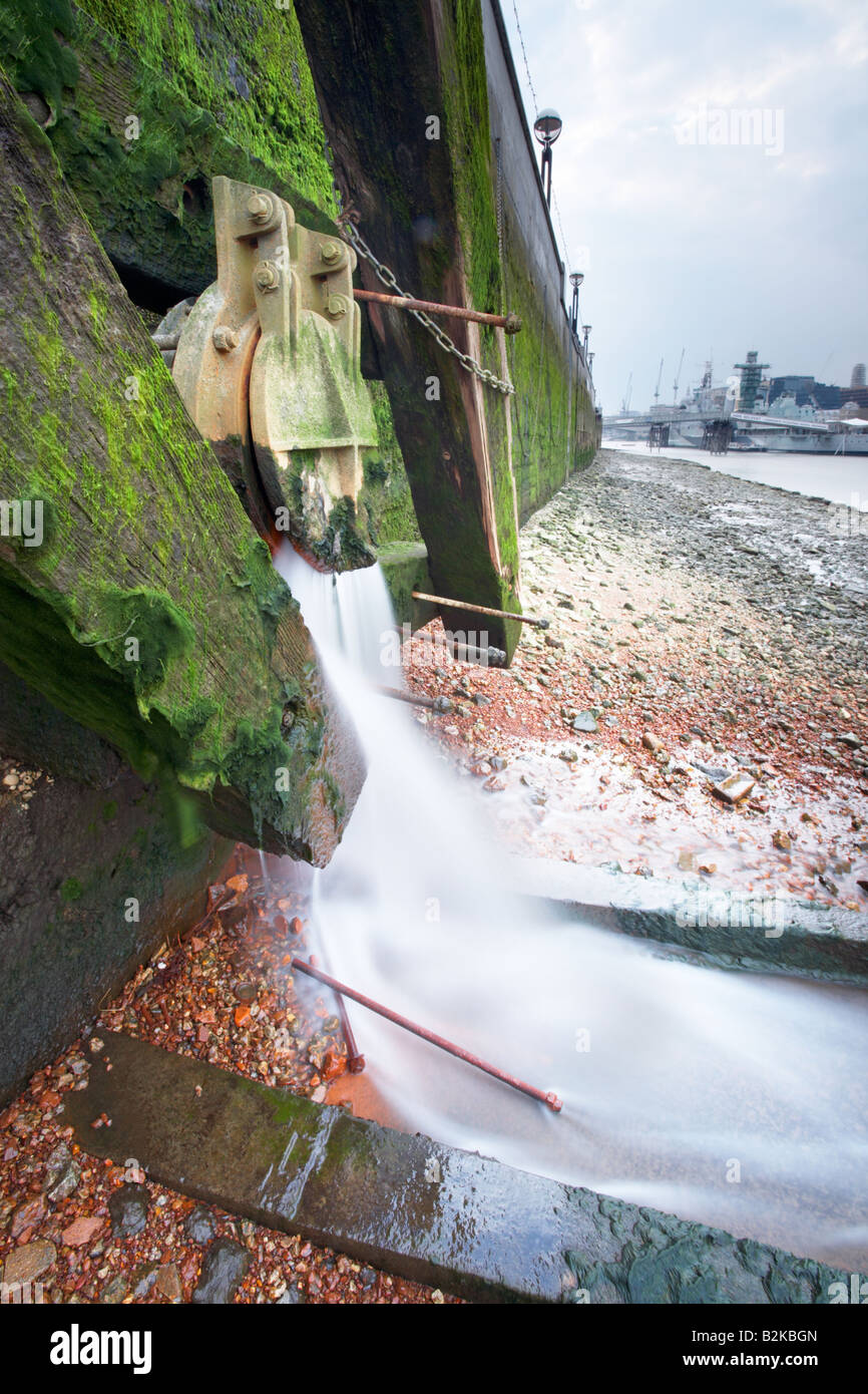 Sewage overflow outlet into the river Thames, London city, England, UK ...