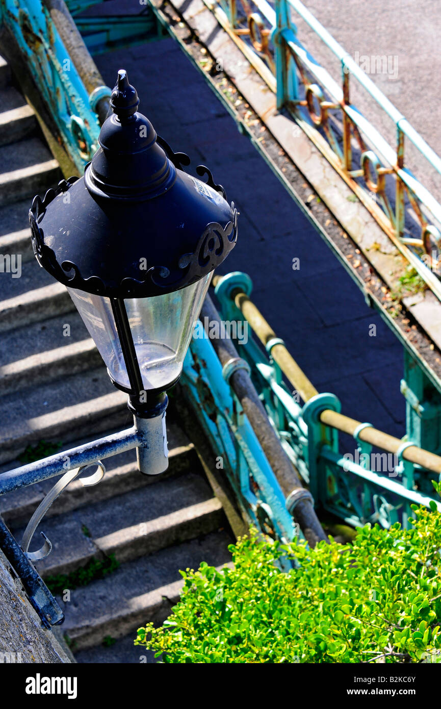 Looking down at steps and pavement below with street lamp in foreground ...