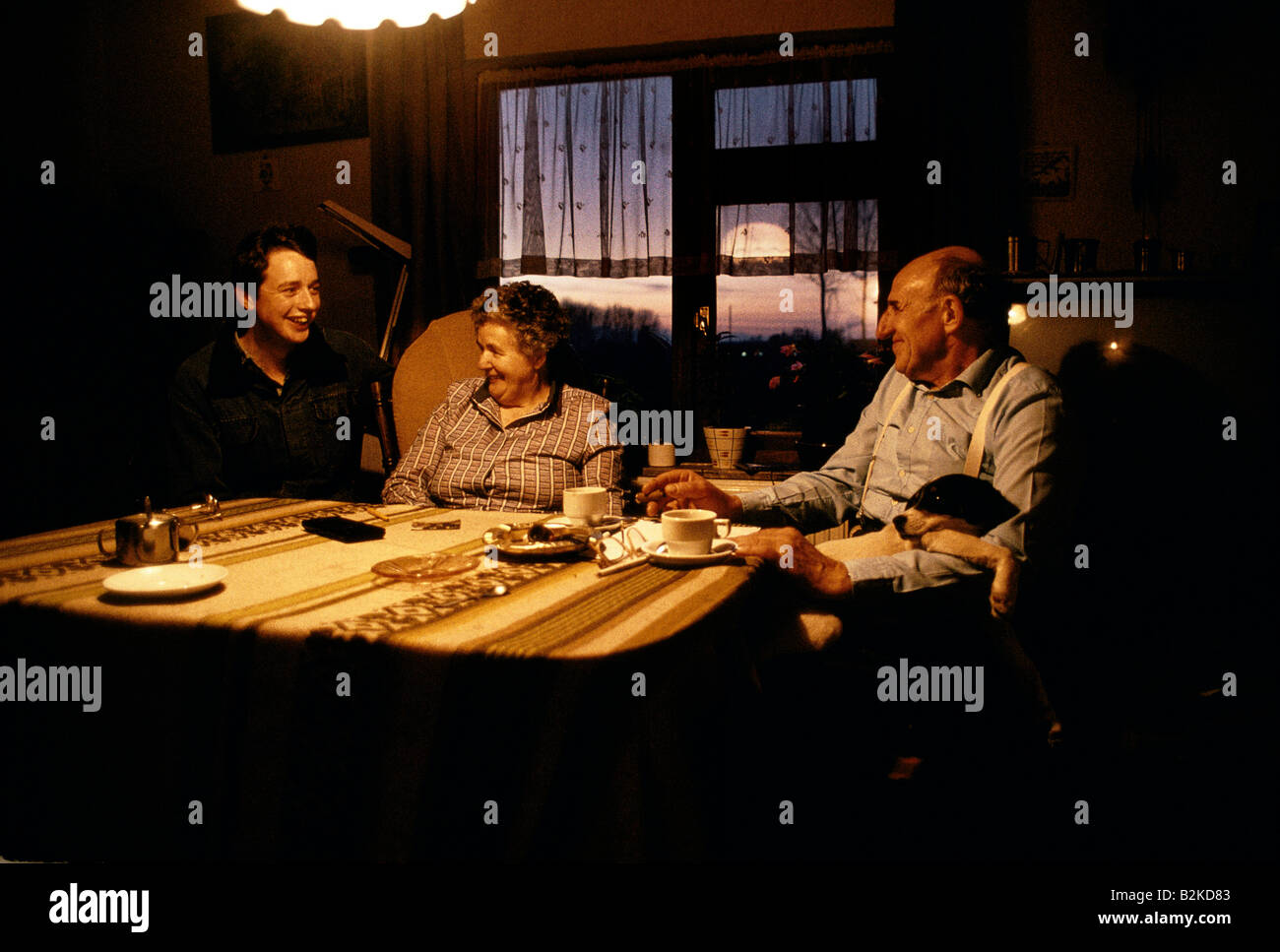 FAMILY VINK SITTING AT TABLE TALKING JOKING TOGETHER THEY ARE FARMERS ...
