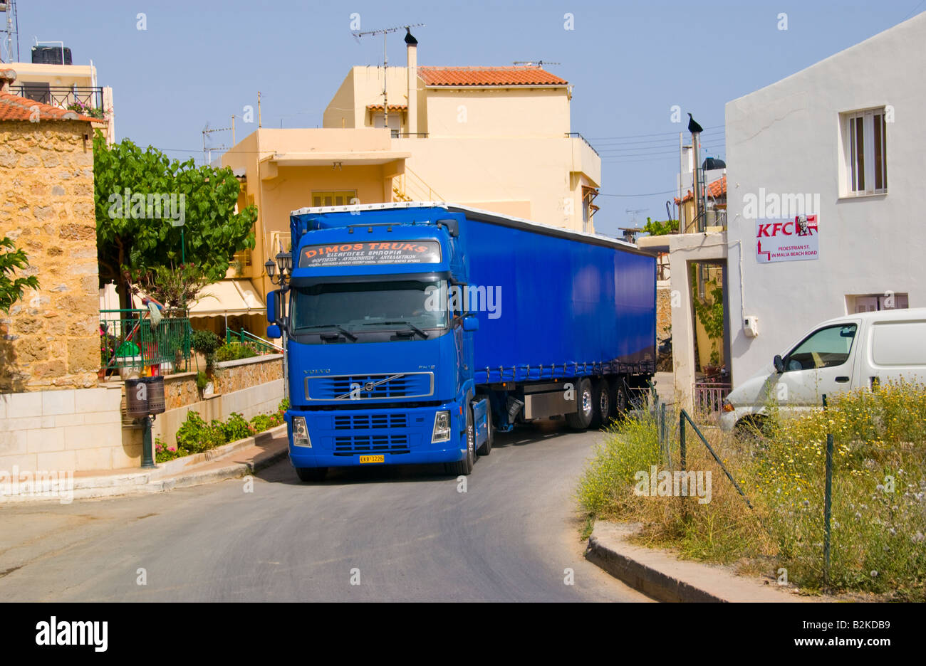 Traffic congestion on narrow streets of Malia Old Town on the Greek ...