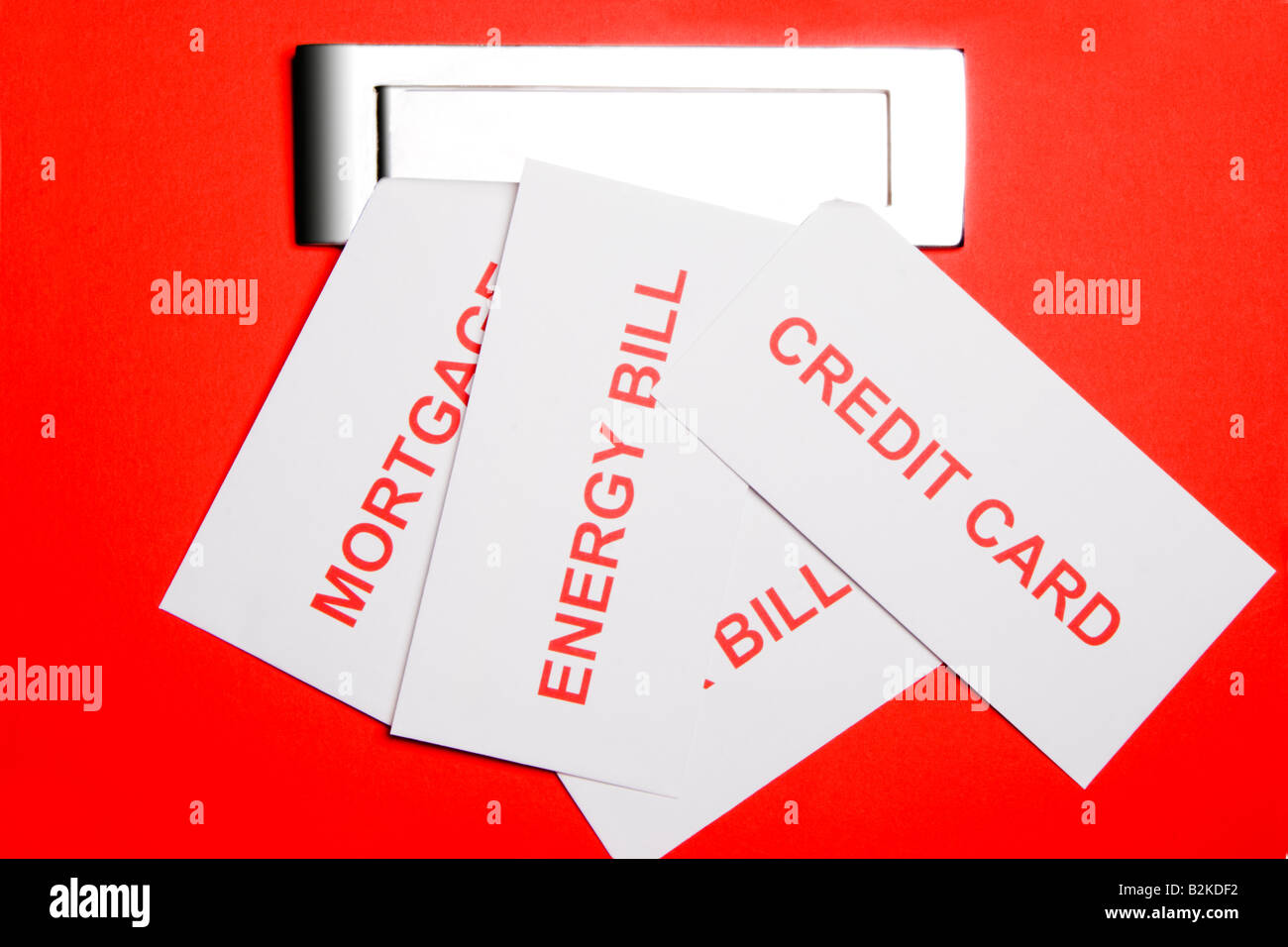 A letter box with invoices and bills pushed through Stock Photo - Alamy