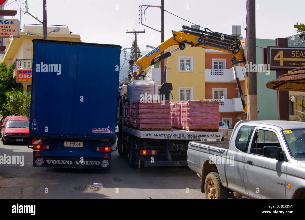 Traffic congestion on narrow streets of Malia Old Town on the Greek ...