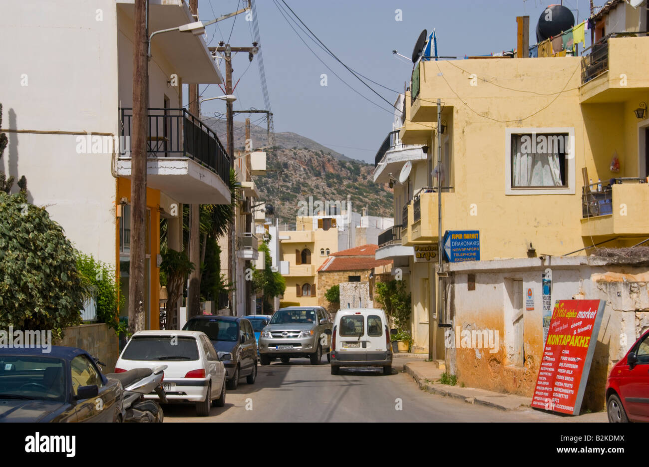 Traffic congestion on narrow streets of Malia Old Town on the Greek ...
