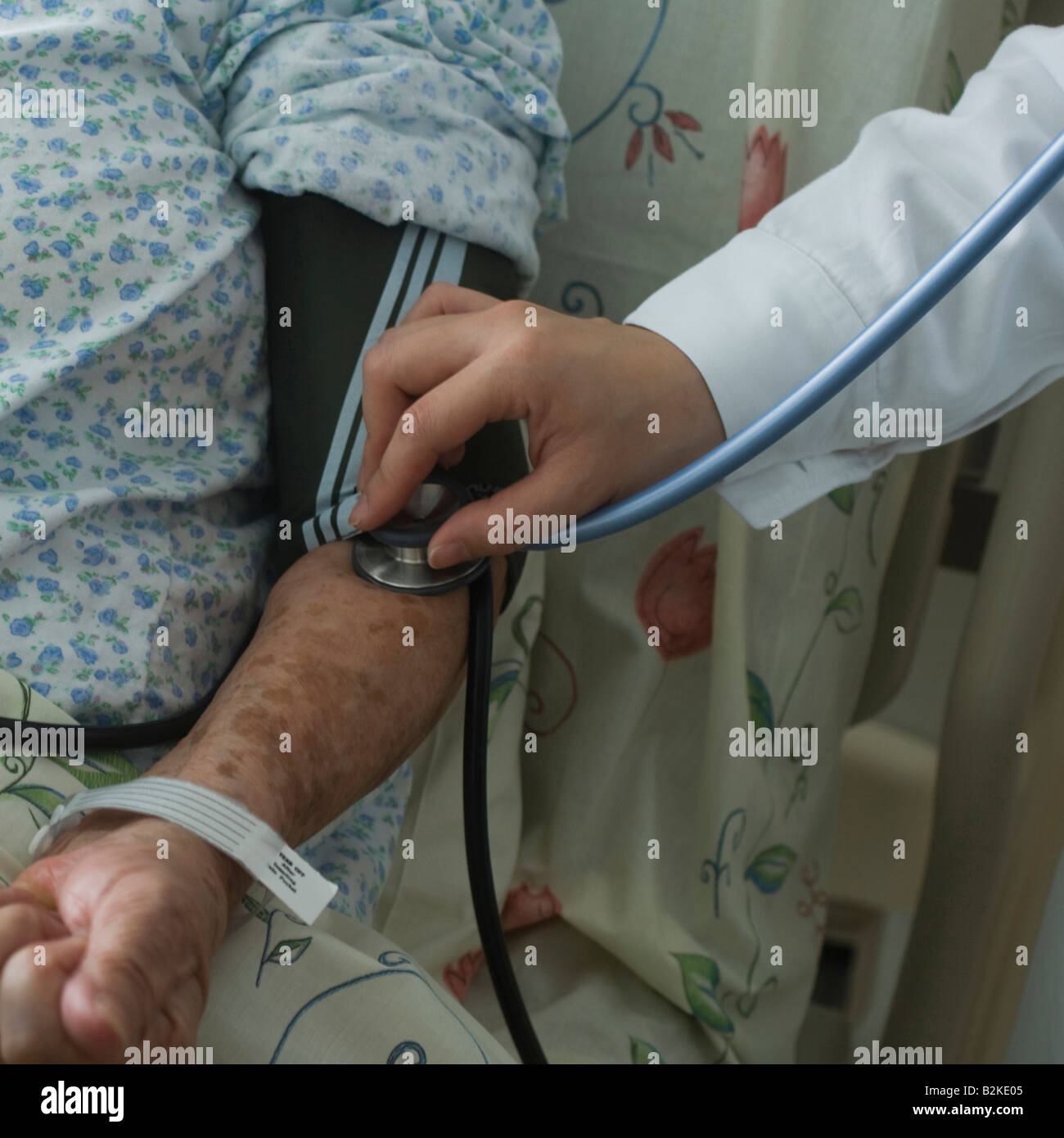 Close-up of a doctor's hand checking a patient's blood pressure Stock ...