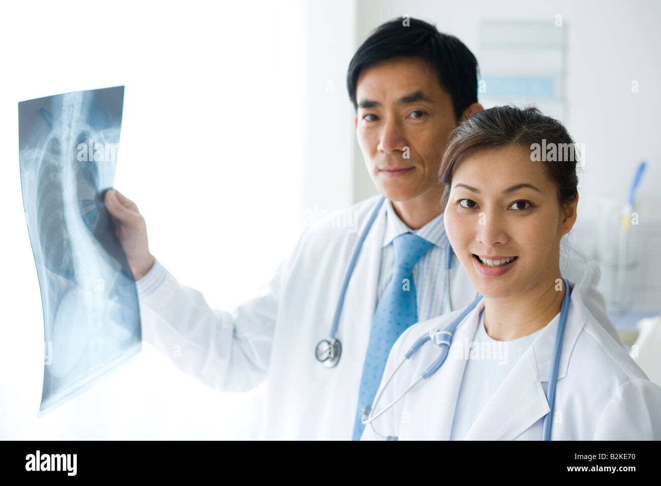 Portrait of two doctors with an X-Ray report Stock Photo - Alamy