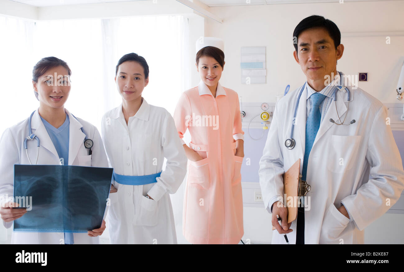 Portrait of medical staff standing in a hospital and smiling Stock ...
