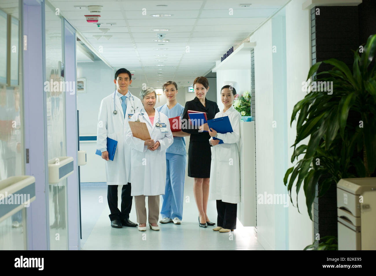 Portrait of medical staff standing in a corridor Stock Photo - Alamy