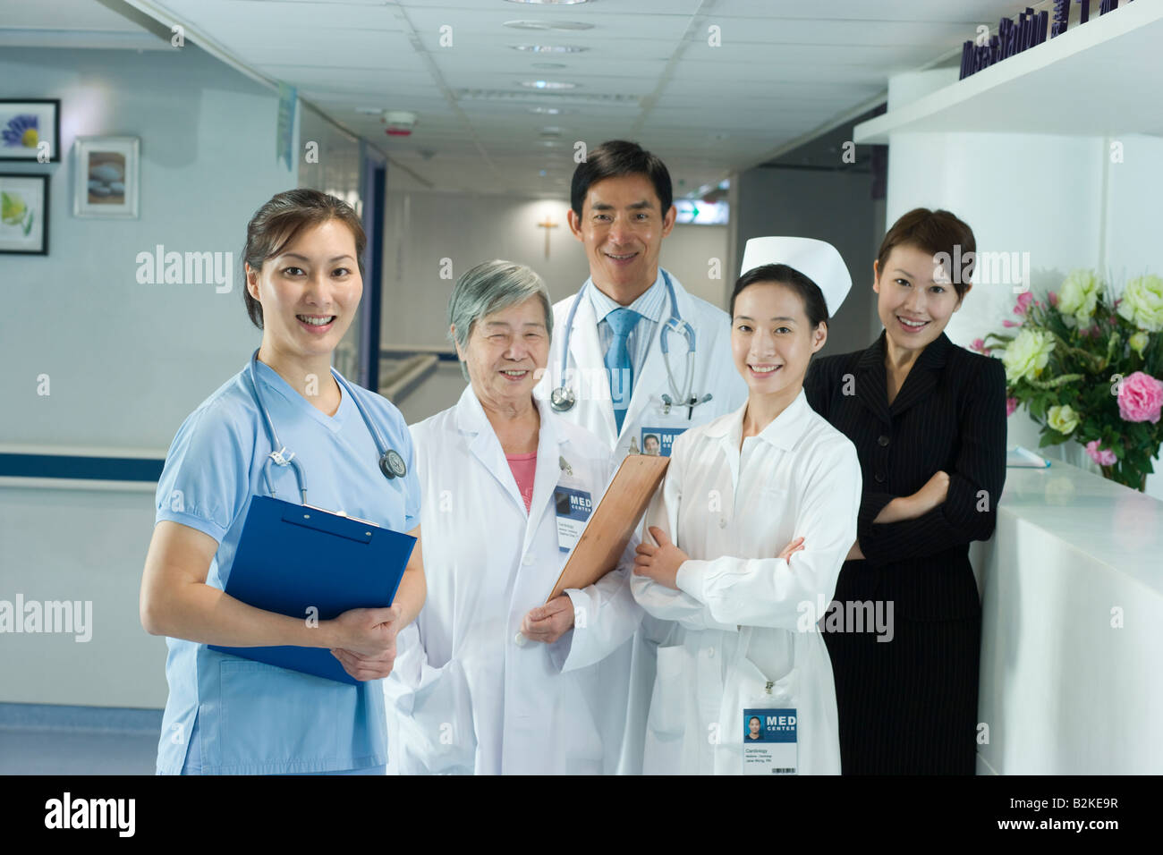 Portrait of medical staff standing in a corridor and smiling Stock ...